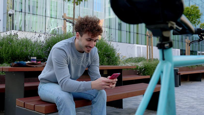 Young Student Using Mobile Phone while Sitting on Table at Campus ...