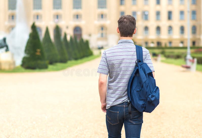 Young Student Walking To the University. Back View Stock Image - Image ...