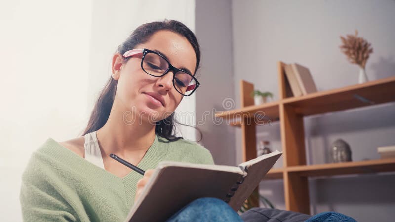 Young Student Writing on Blurred Notebook Stock Photo - Image of ...