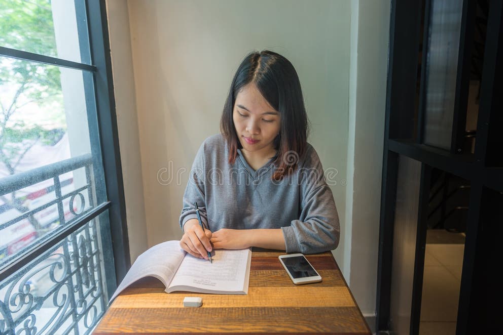 Young Student Writing Note, Take Note, Doing Homework on Book Stock ...