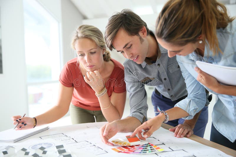 Young Students of Architecture Working on Color Designs Stock Photo ...