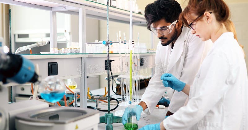 Young Students of Chemistry Working in Laboratory Stock Photo - Image ...