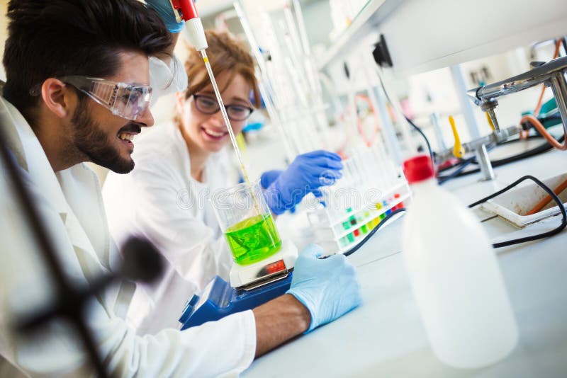 Young Students of Chemistry Working in Laboratory Stock Image - Image ...