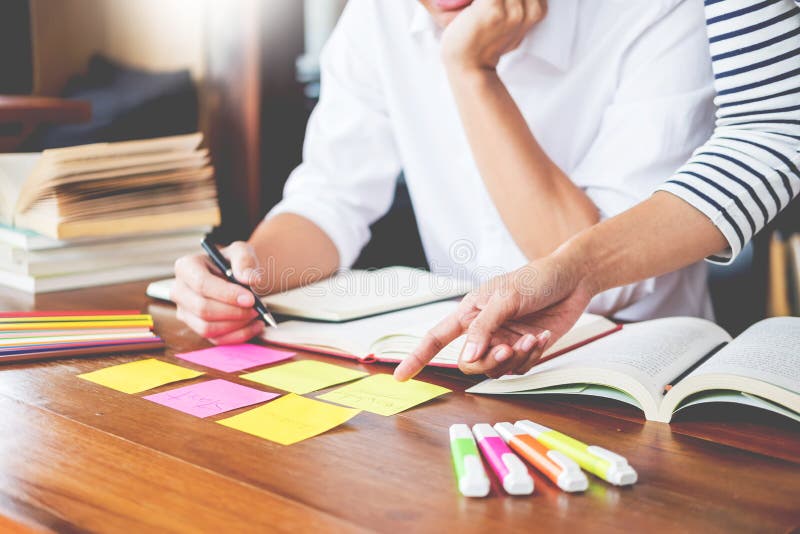 Young Students Classmates Help Friend Catching Up Workbook and Learning ...