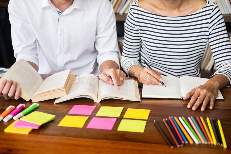Young Students Classmates Help Friend Catching Up Workbook and Learning ...