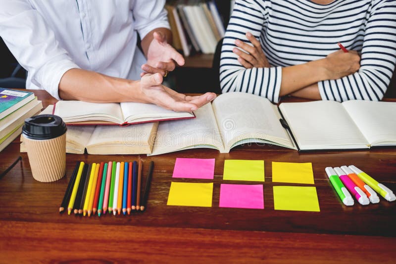 Young Students Classmates Help Friend Catching Up Workbook and Learning ...