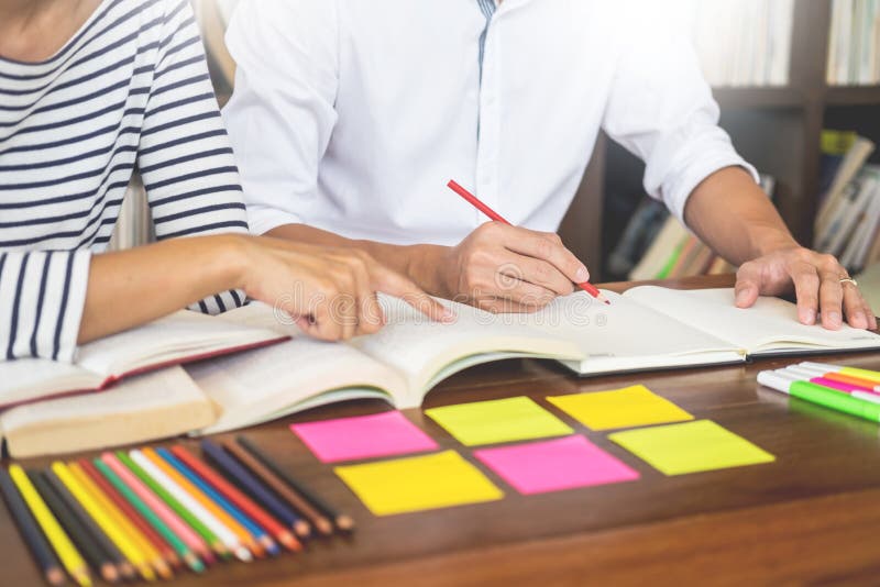 Young Students Classmates Help Friend Catching Up Workbook and Learning ...