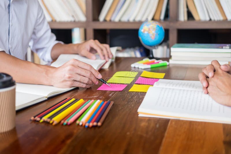Young Students Classmates Help Friend Catching Up Workbook and Learning ...