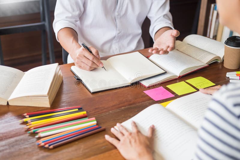 Young Students Classmates Help Friend Catching Up Workbook and Learning ...
