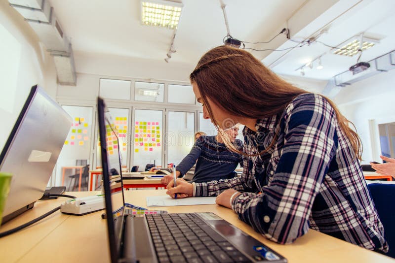 Students writing on class stock photo. Image of knowledge - 151542710