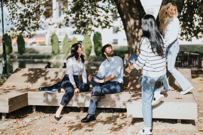 Young Students Collaborating in a Park, Discussing Topics, Doing ...