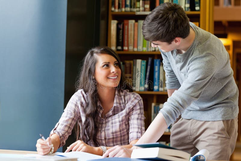Young Students Helping Each Other Stock Photo - Image of attractive ...