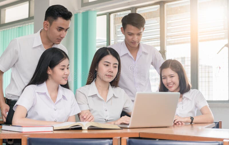 Young Students Looking Notebook for Doing Homework Stock Image - Image ...