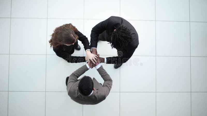 Top View of Young People Putting Their Hands on Top of Each Other ...