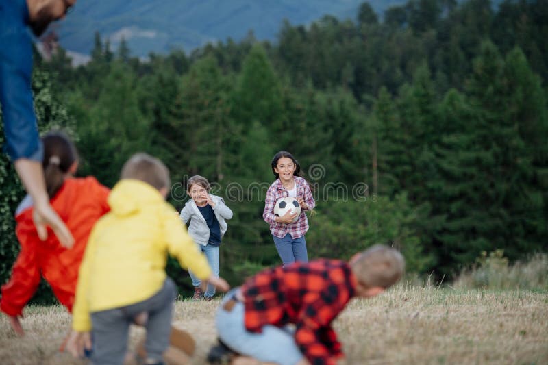 Young Students Playing with Teacher Outdoors, in Nature, during Field ...