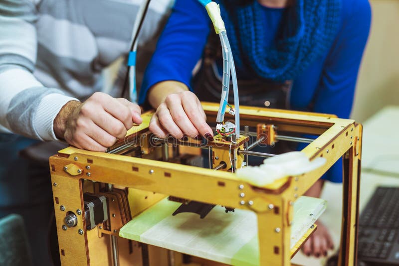 Young Students Researchers Using an Innovative 3D Printer Stock Photo ...