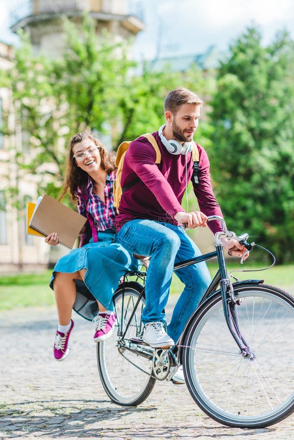 Young Students Riding Bicycle Together Stock Image - Image of bike ...