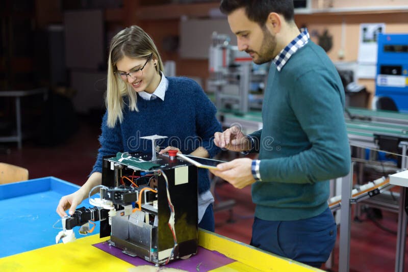 Young Students of Robotics Preparing Robot for Testing Stock Photo ...