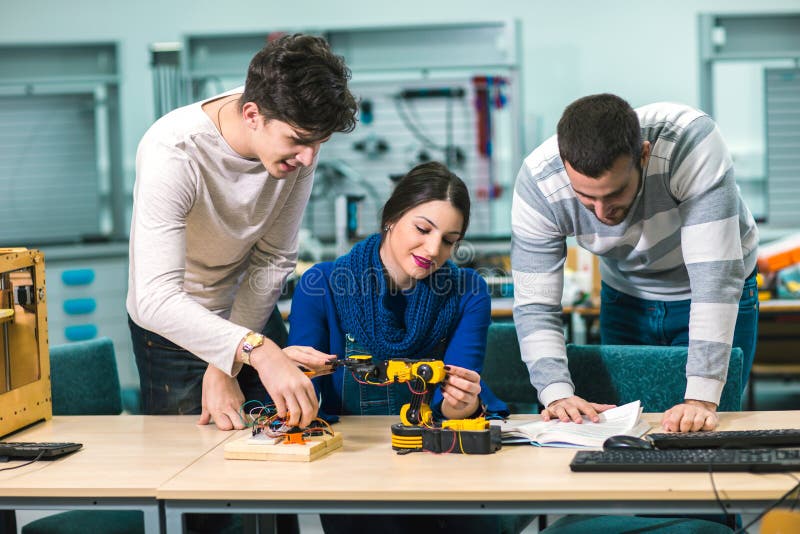 Students of Robotics Preparing Robot for Testing in Worksh Stock Photo ... Students of Robotics Preparing Robot for Testing in Worksh Stock Photo ...