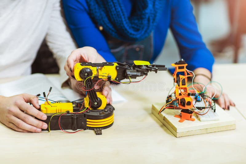 Young Students of Robotics Preparing Robot for Testing Stock Photo ...