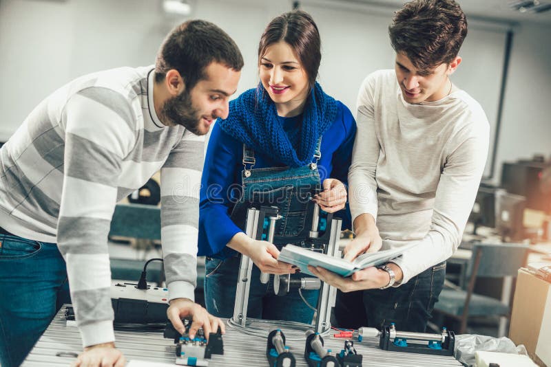 Young Students of Robotics Preparing Robot for Testing Stock Image ... Young Students of Robotics Preparing Robot for Testing Stock Image ...