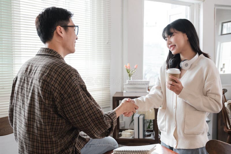 Young Students Sit in the Library Studying, Sharing Knowledge and ...