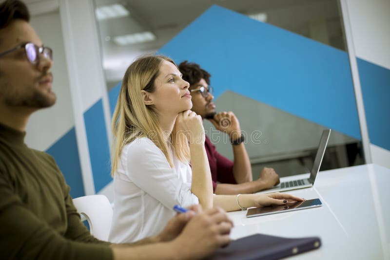Young Students Sitting in the Classroom Stock Photo - Image of ...