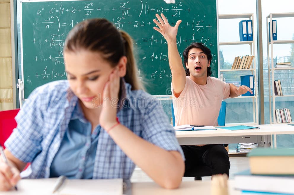 The Young Students Taking the Math Exam in Classroom Stock Photo ...
