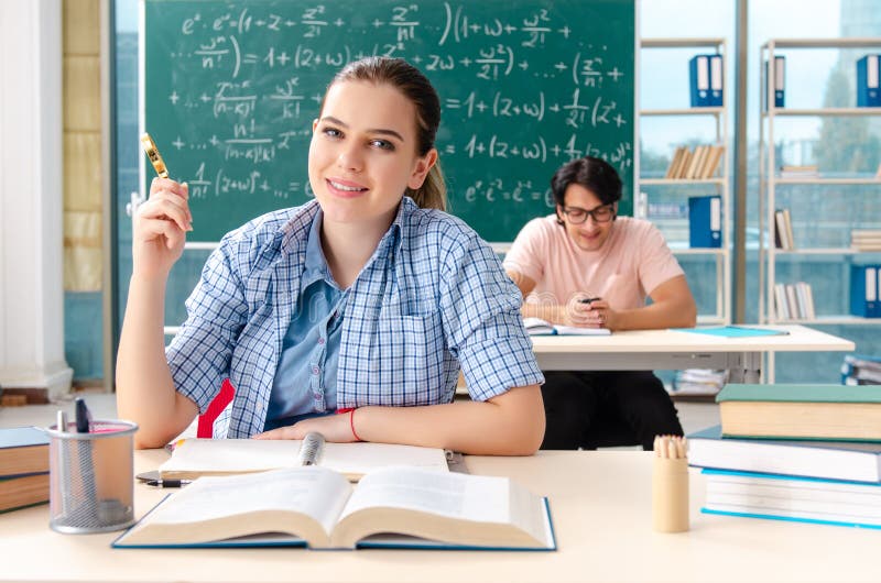 The Young Students Taking the Math Exam in Classroom Stock Photo ...