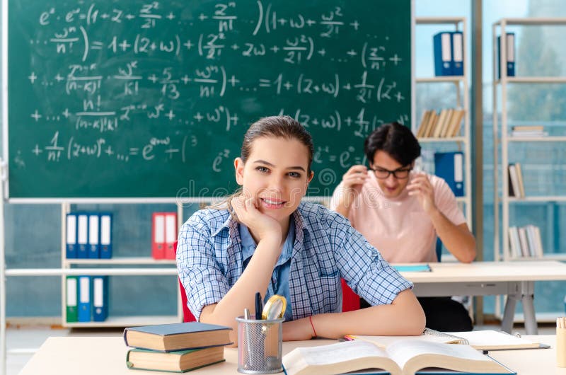 The Young Students Taking the Math Exam in Classroom Stock Image ...