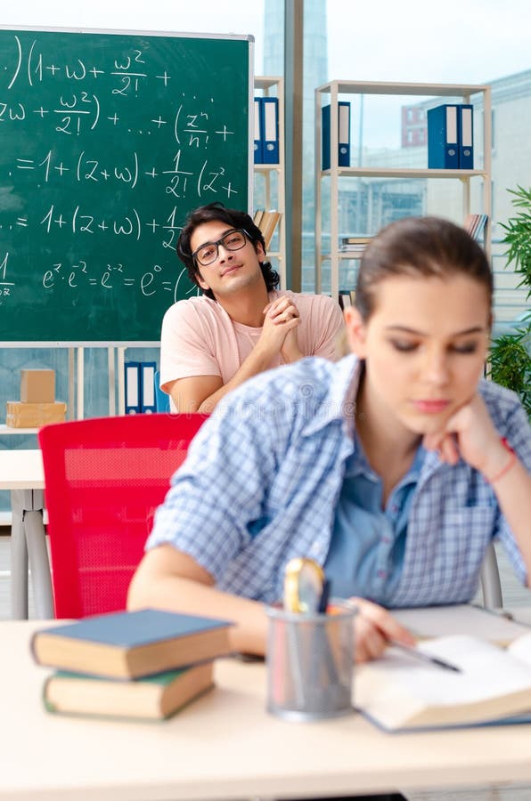 The Young Students Taking the Math Exam in Classroom Stock Photo ...