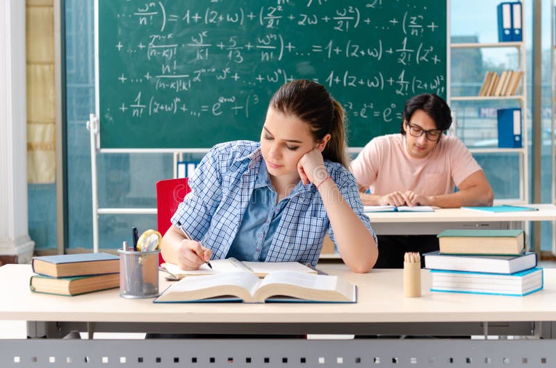 The Young Students Taking the Math Exam in Classroom Stock Photo ...