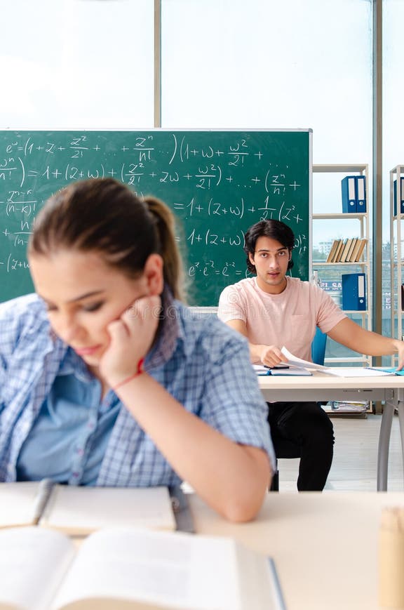 The Young Students Taking the Math Exam in Classroom Stock Photo ...