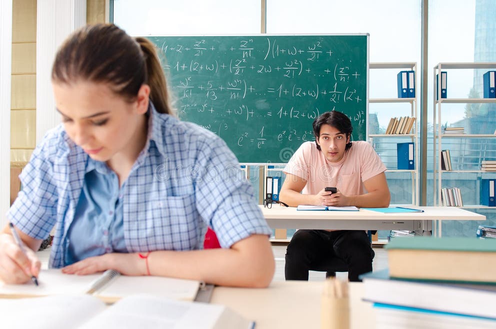 The Young Students Taking the Math Exam in Classroom Stock Image ...