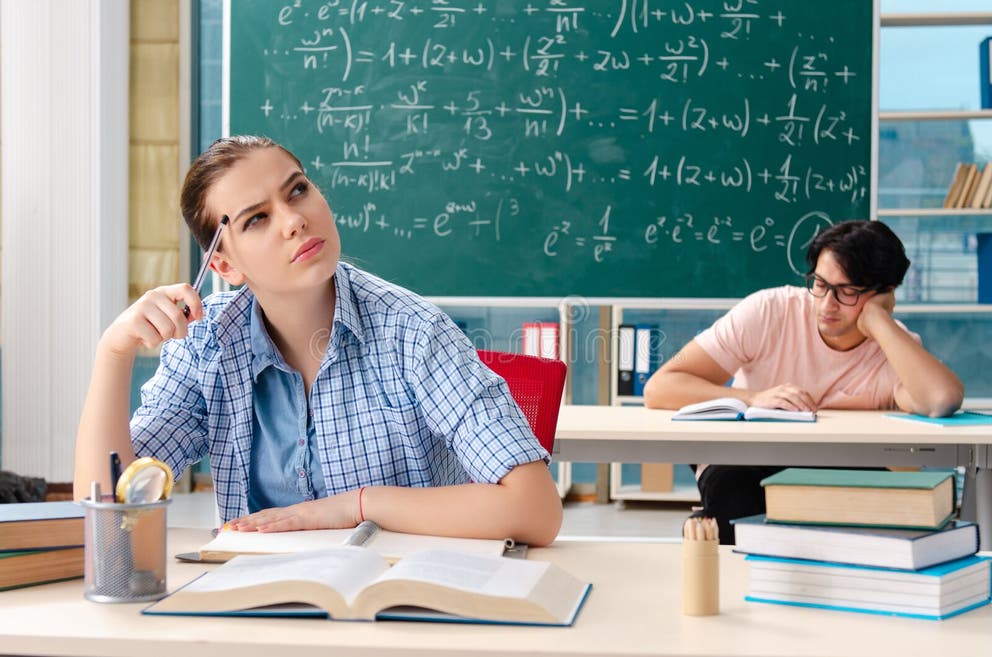 The Young Students Taking the Math Exam in Classroom Stock Photo ...