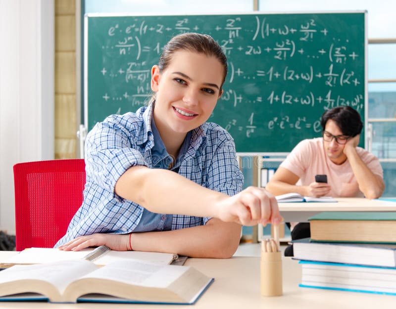 The Young Students Taking the Math Exam in Classroom Stock Photo ...