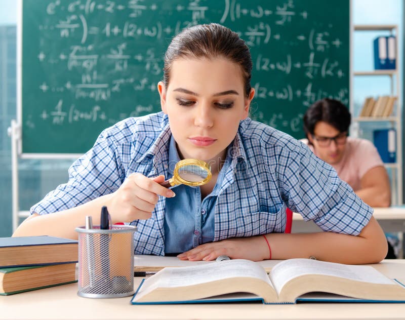 The Young Students Taking the Math Exam in Classroom Stock Photo ...