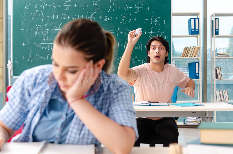 The Young Students Taking the Math Exam in Classroom Stock Photo ...