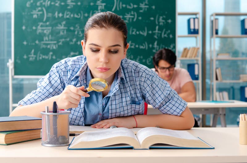 The Young Students Taking the Math Exam in Classroom Stock Image ...