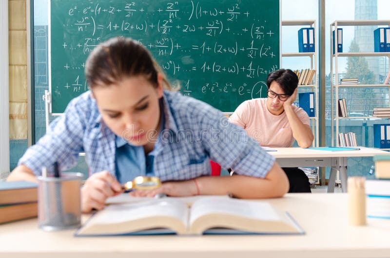 The Young Students Taking the Math Exam in Classroom Stock Photo ...