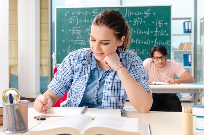 The Young Students Taking the Math Exam in Classroom Stock Photo ...