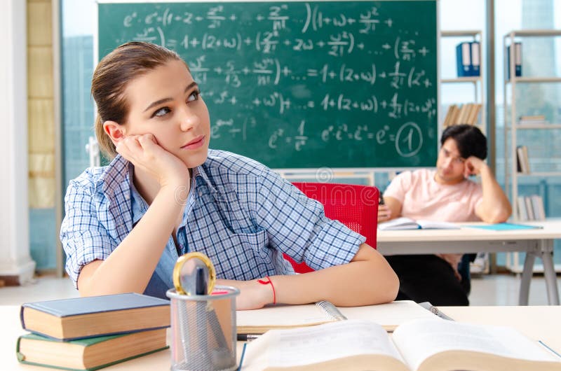 The Young Students Taking the Math Exam in Classroom Stock Photo ...