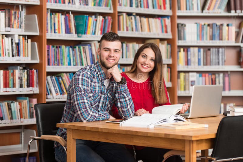 Young Students Using Their Laptop in a Library Stock Photo - Image of ...