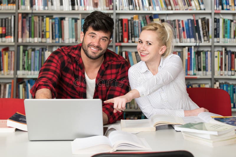 Young Students Using Their Laptop in a Library Stock Photo - Image of ...
