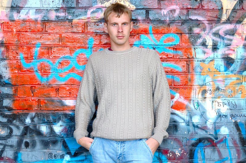 Young Stylish Man Stand Near Graffiti Brick Wall. Stock Image - Image ...