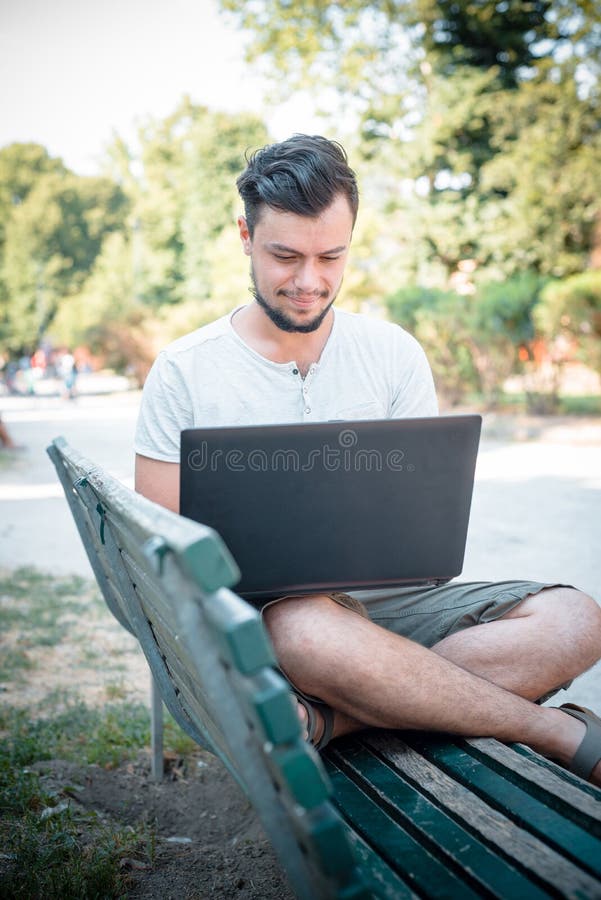 Young Stylish Man Using Notebook Stock Photo - Image of modern, park ...