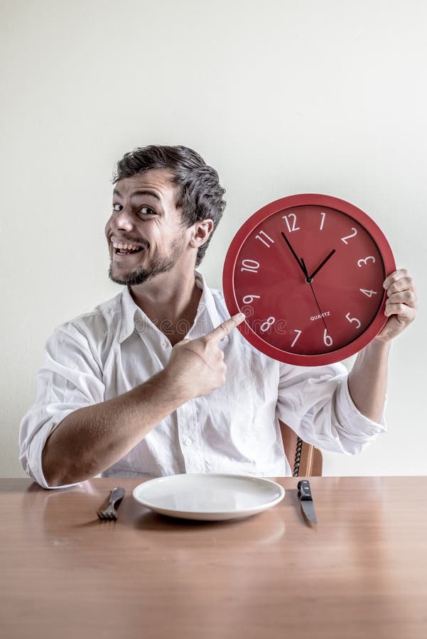 Young Stylish Man with White Shirt Holding Red Clock Stock Image ...