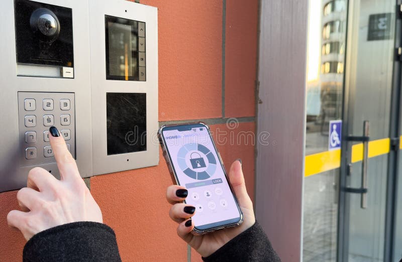 Young Stylish Woman Getting Access To the Building by Attaching ...
