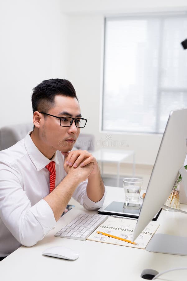 Young Stylish Worker at Office Working with Computer and Thinking How ...