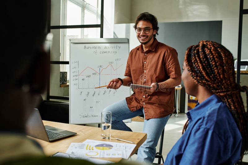 Young Successful Coach with Pencil Sitting by Whiteboard Stock Image ...